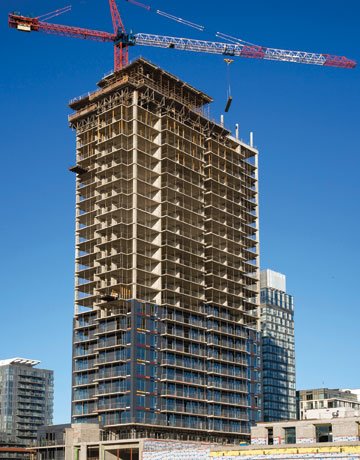 Glass installation continues on Paint Box condos in Toronto