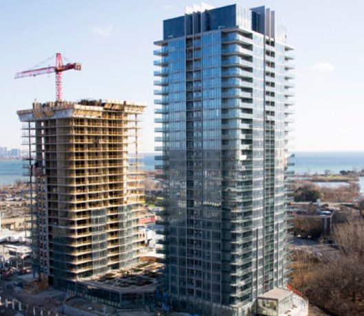 Contractors install glass on Amexon South Beach Condos in Toronto