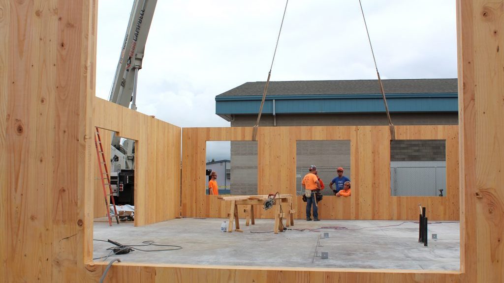 Wood construction pushes forward on both sides of the border